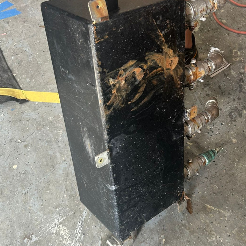 Corroded marine pump box showing galvanic corrosion damage